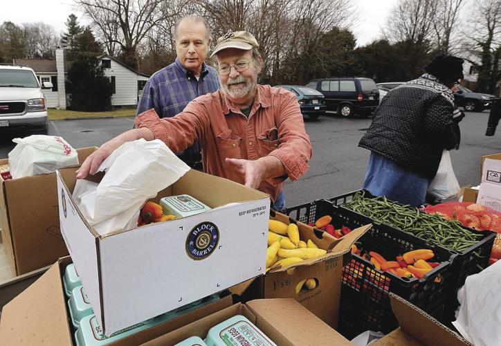 Providing a helping hand: Distribution from church aids those who are ...