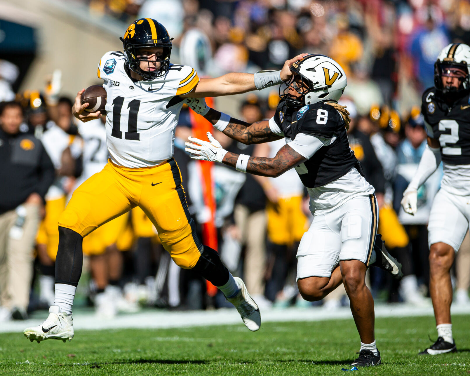 Iowa holds off Vanderbilt's comeback bid for 34-27 victory in the ...