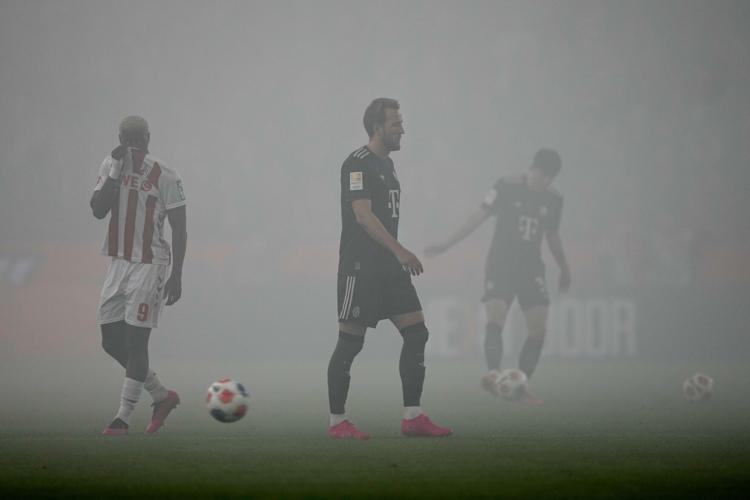 Bayern beats Cologne and sets a record after smoke stops play in ...