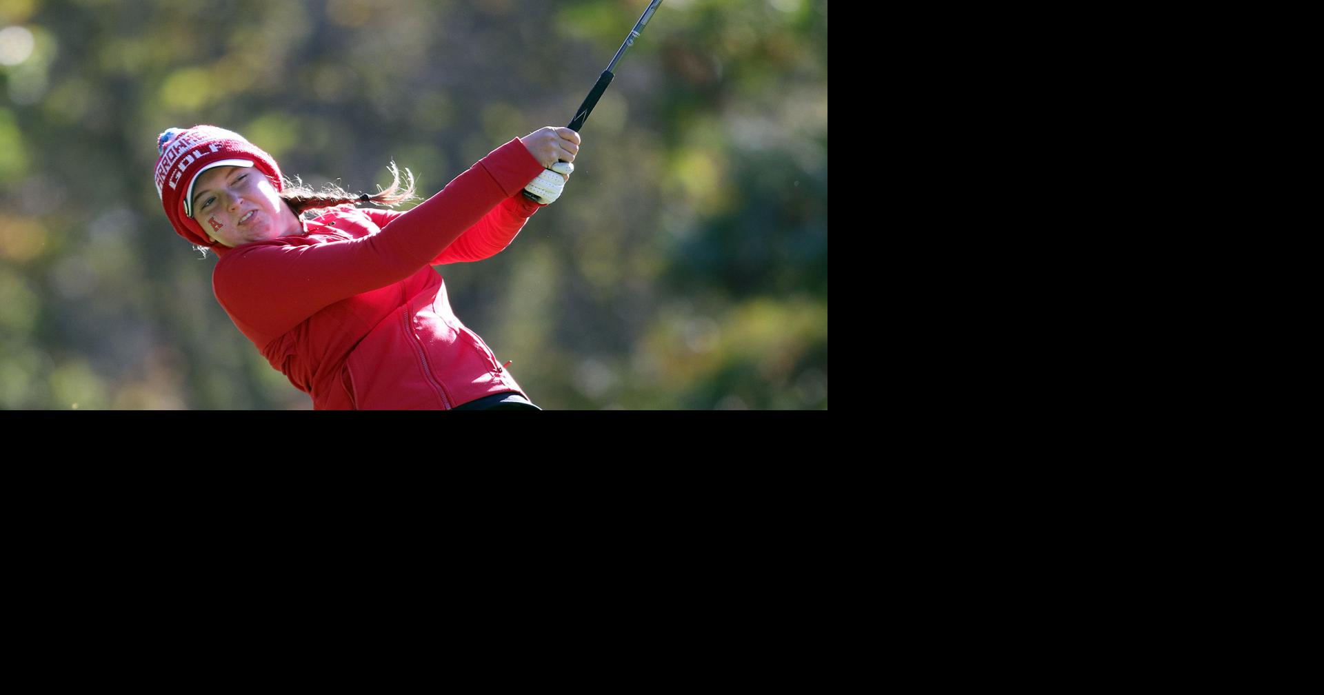 Defending champ Lauren Peterson gets help from freshman Jessica Guiser ...