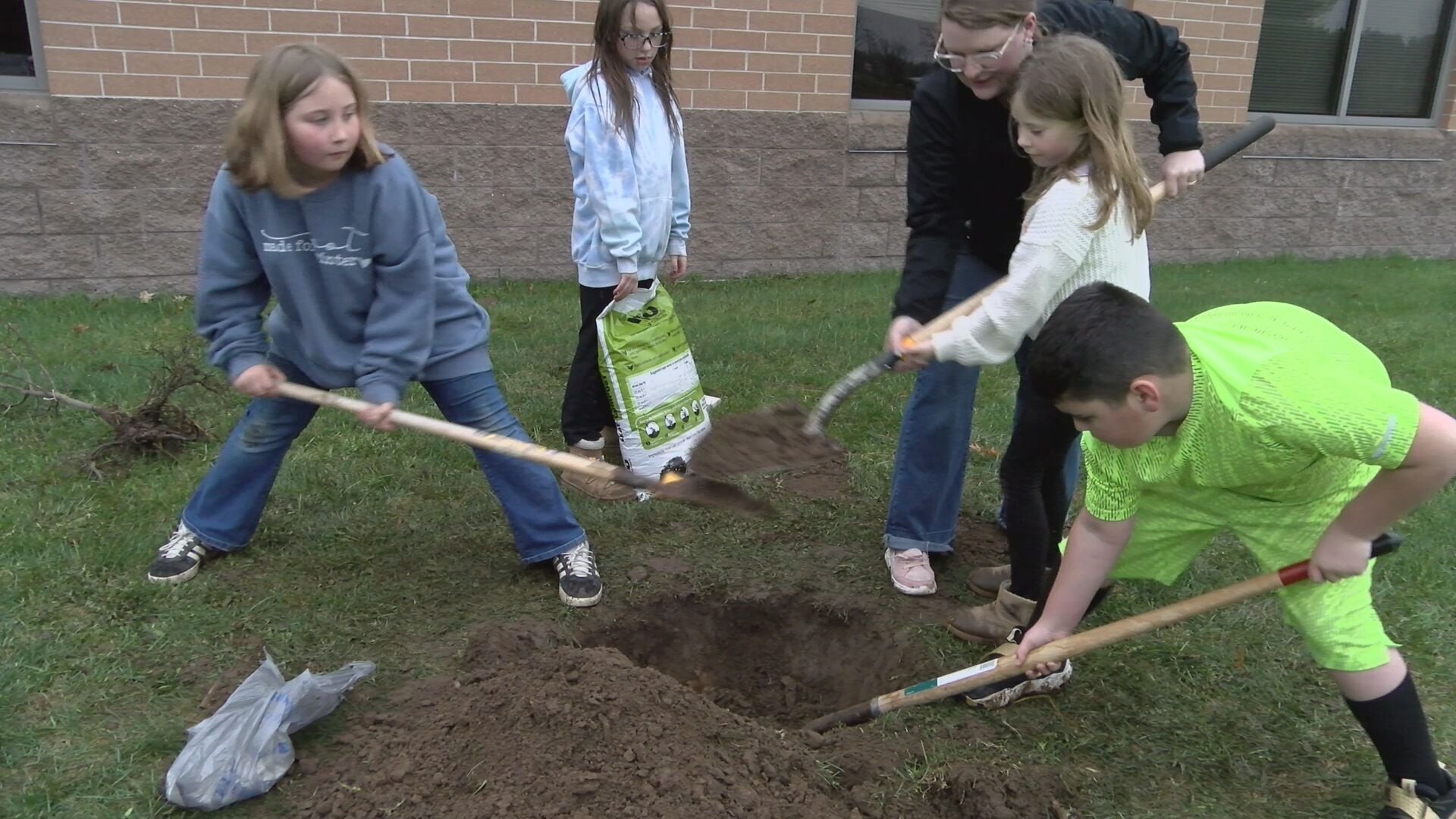 Kids get hands dirty planting trees at YMCA of the Northwoods for Arbor ...