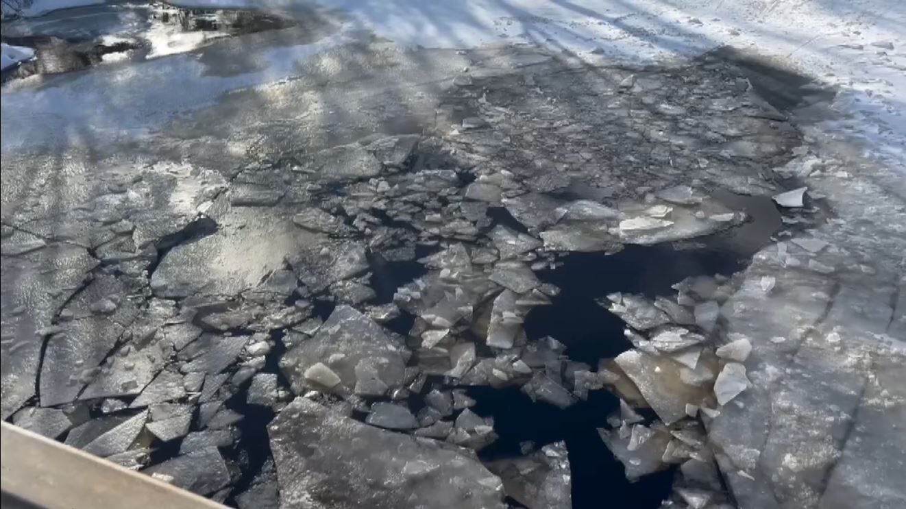 Snowmobiler goes through ice on Boom Lake near Eagle Street bridge in ...