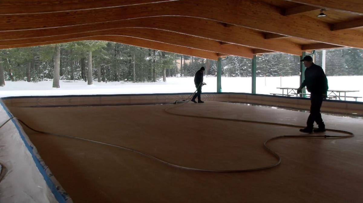 St. Germain Fire department constructs ice rink under town pavillion ...