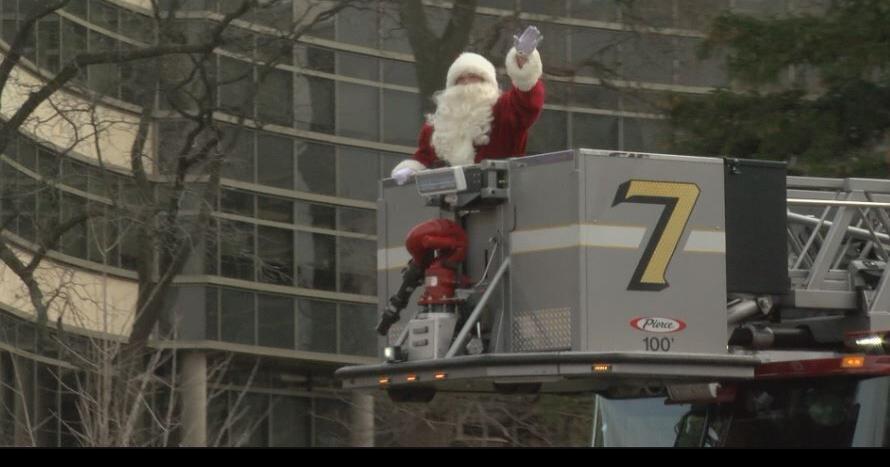 Santa Claus takes a ride in a firetruck to visit good little girls and ...