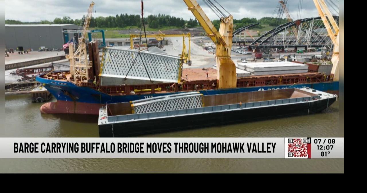 Bridge On Smooth Water: Barge Carrying Buffalo Pedestrian Bridge Moves ...