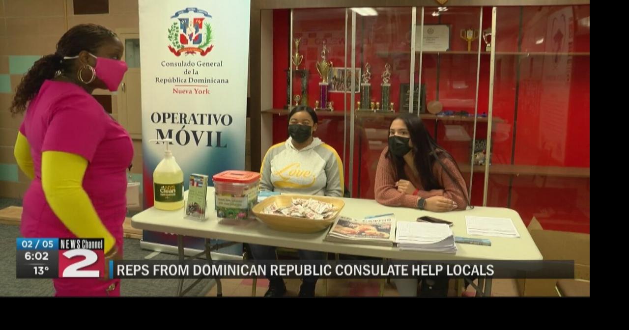 Representatives from the Dominican Republic Consulate help locals ...