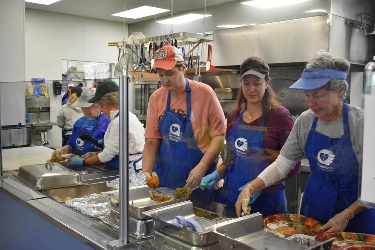 Community Kitchen fills stomachs, warms hearts on Thanksgiving day ...