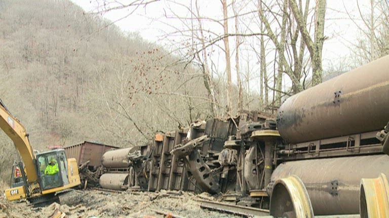 West Virginia mudslide pushes train cars into creek, knocks homes off ...