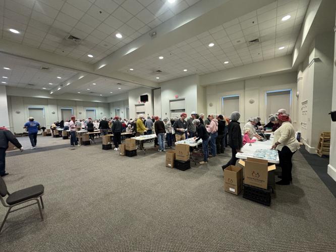 Paducah Rotary Club partners with Love the Hungry to package roughly ...