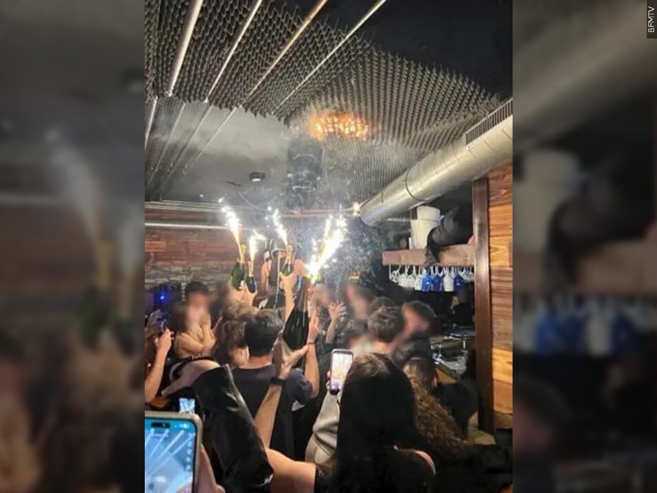 Swiss investigators believe sparkling candles atop wine bottles ignited ...