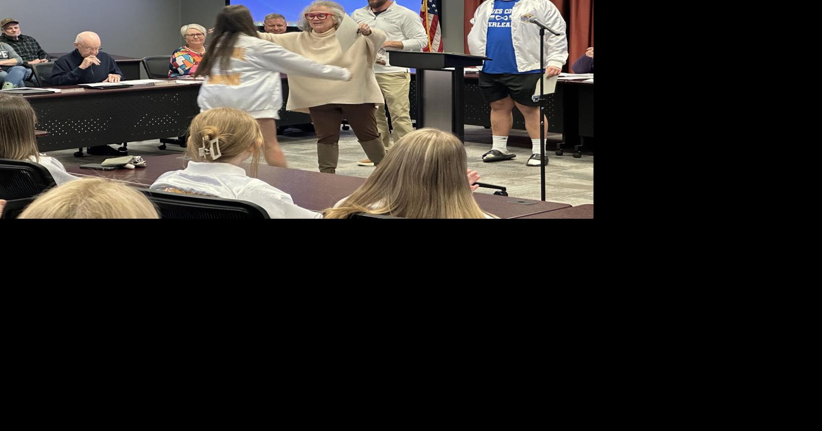 Local leaders honor cheer squad and late artist during monthly meeting ...