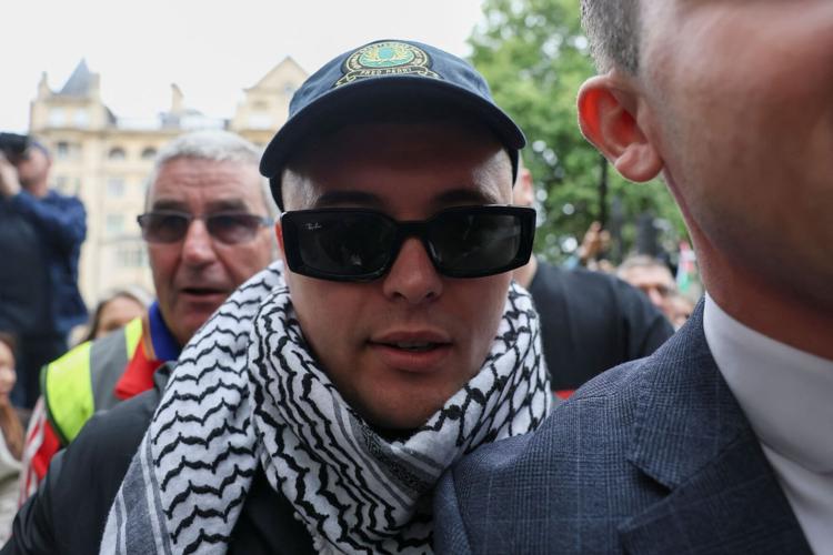 Hundreds of protesters turn up to support Irish rapper as he appears in ...