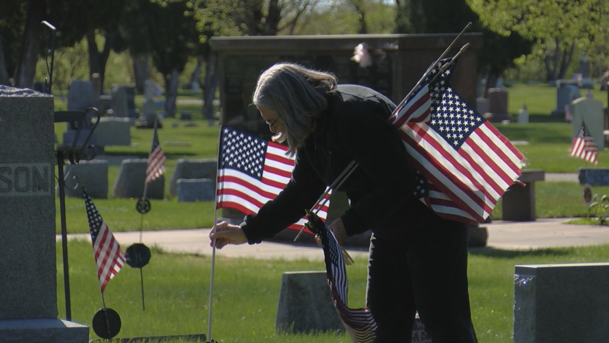 Volunteers place flags on Eau Claire veterans' graves ahead of Memorial ...