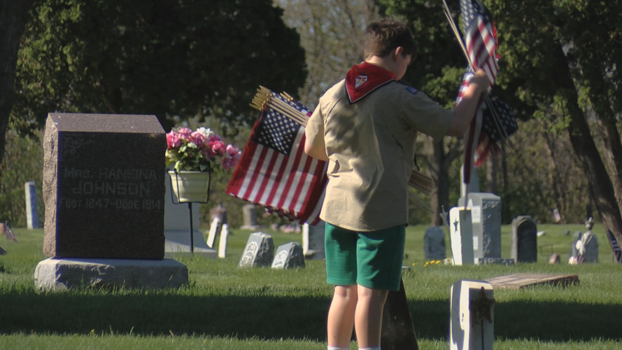 Volunteers place flags on Eau Claire veterans' graves ahead of Memorial ...