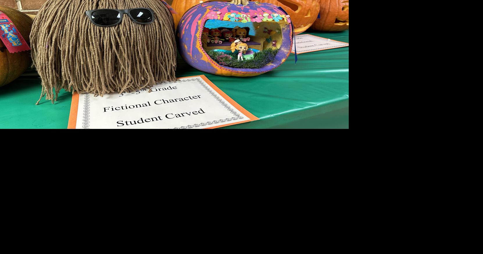 Elementary students get in Halloween spirit with pumpkin carving ...