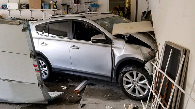 Car crashes into building, one person suffers minor injuries | News ...