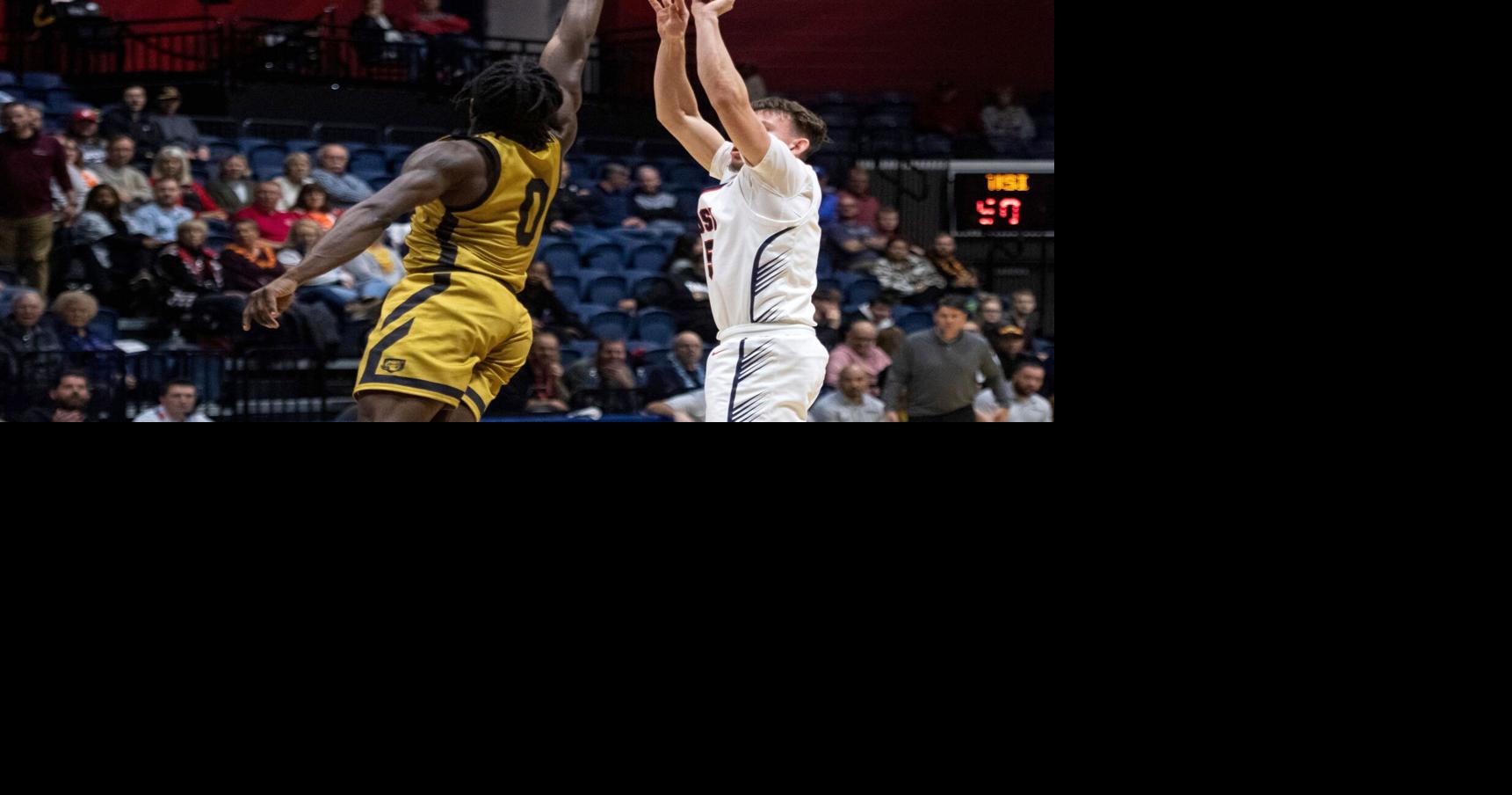 College basketball player blocks shot with unorthodox method – using ...