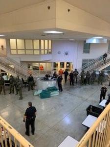 Several Bottles of 'Hooch' Seized, Graffiti Discovered During Cell ...