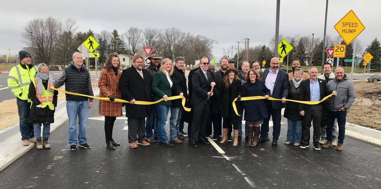 Local officials celebrate opening of Wolfs Crossing and Harvey Road ...