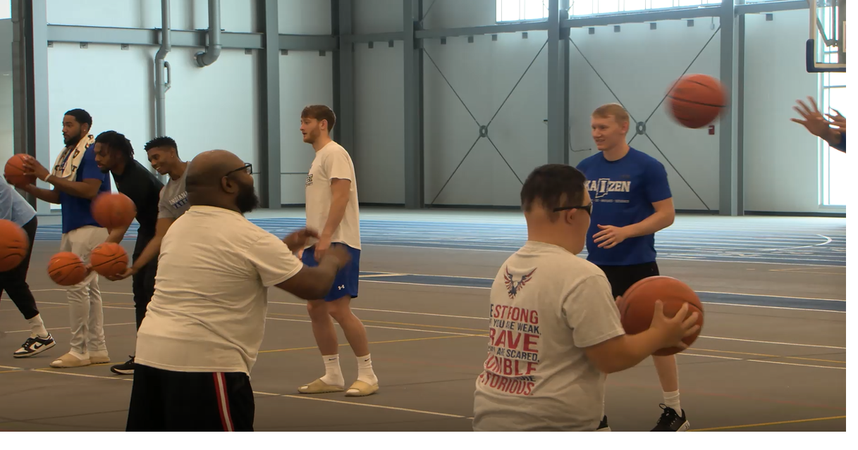Indiana State University basketball team shoots hoops with people with ...