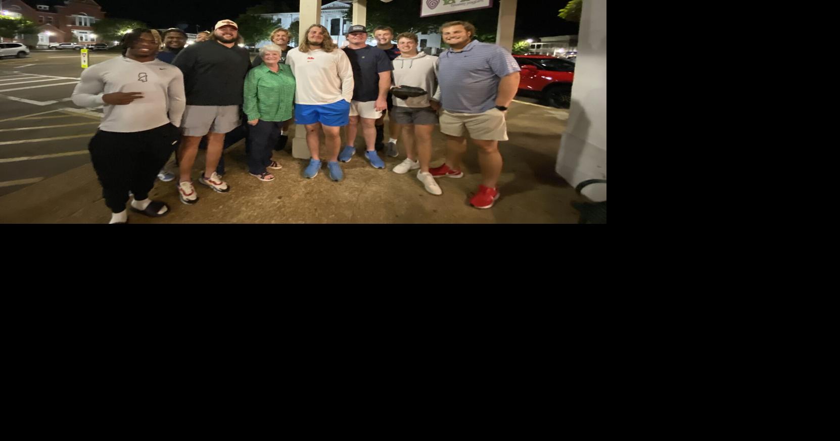 "Rebel Nana" with Ole Miss football players | | wtva.com