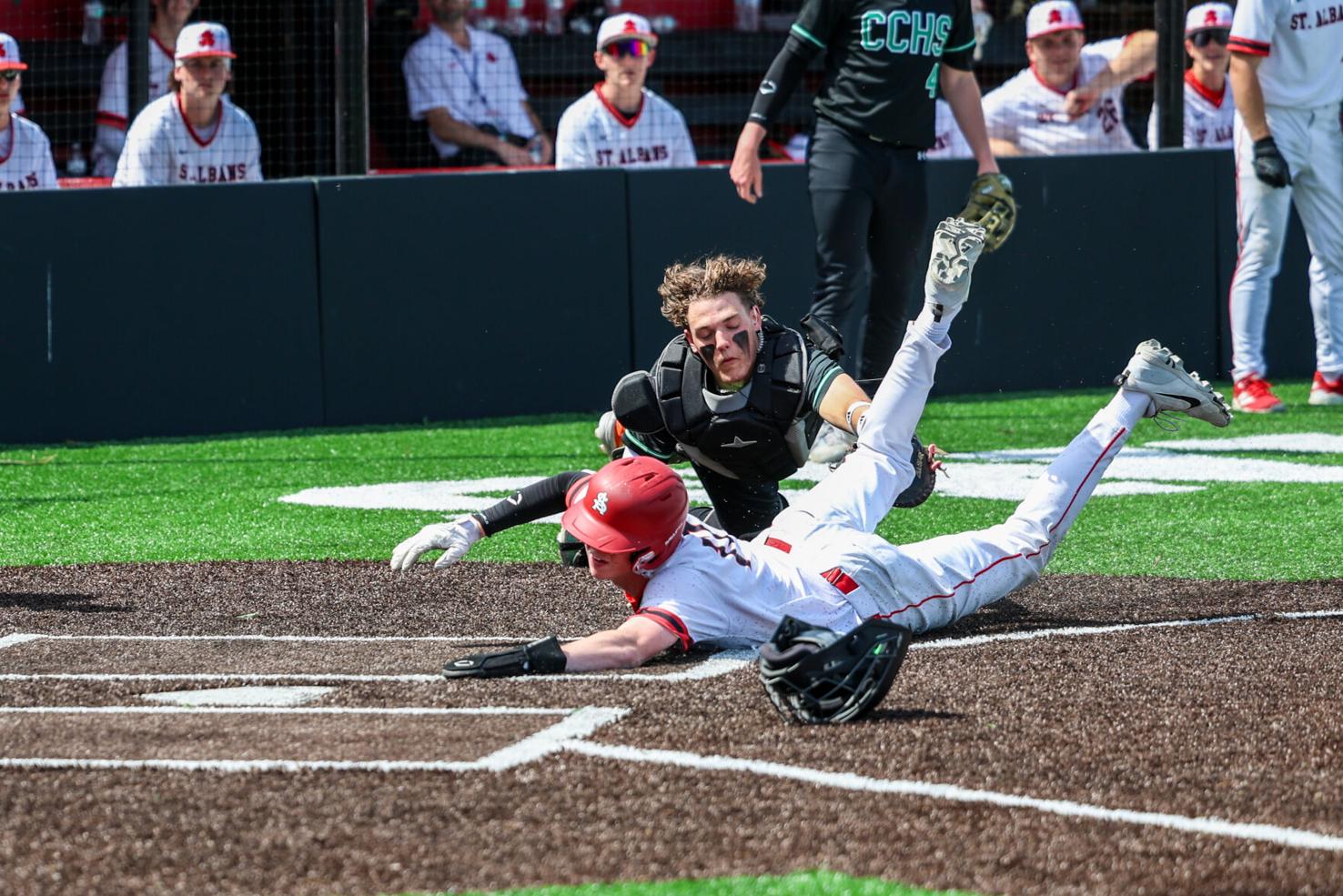 Zaden Ranson tags Brayden Smith as he slides into home.jpg ...