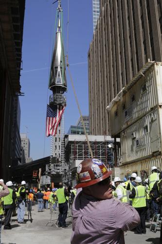 US flag-covered spire hoisted to NY's WTC roof | News | wvgazettemail.com