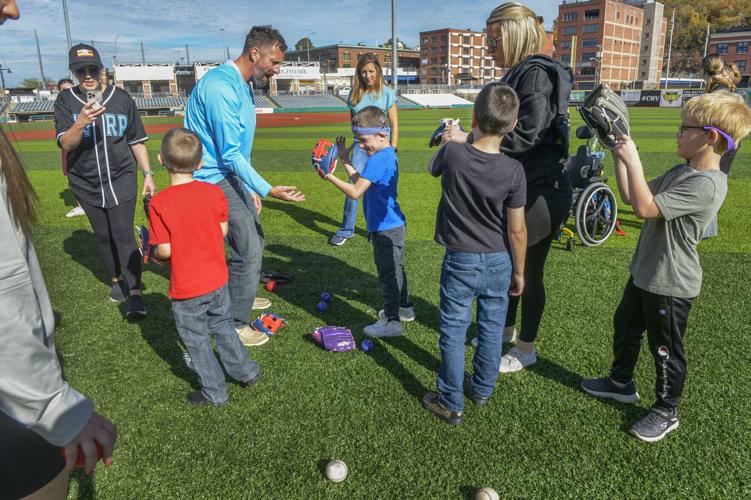 Visually impaired students learn baseball with the Dirty Birds ...