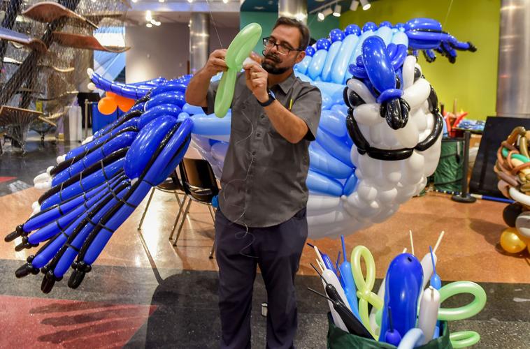 PHOTOS: Balloon artist's new FestivALL sculpture ready to take flight ...