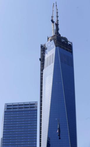 US flag-covered spire hoisted to NY's WTC roof | News | wvgazettemail.com