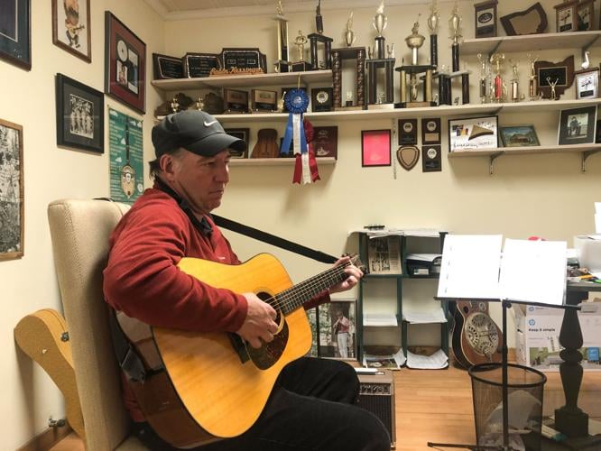 Champion guitar player continues family legacy while handing the music ...