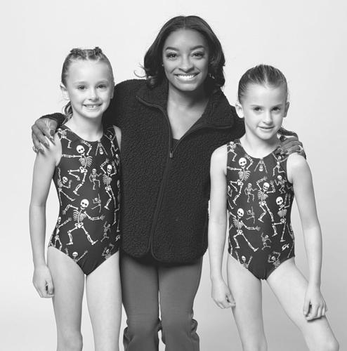 Cross Lanes gymnasts model with Olympic legend Simone Biles | Metro ...