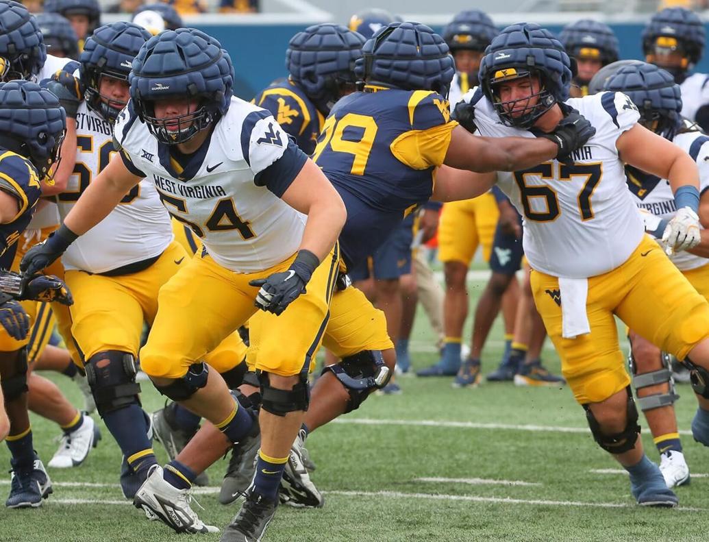 WVU's offensive line grow standing out in fall camp | WVU ...
