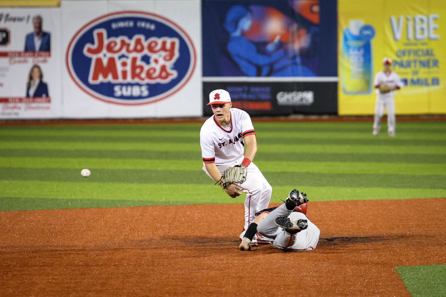 Runner Cruz Hunt makes it back to second base before the throw.jpg ...