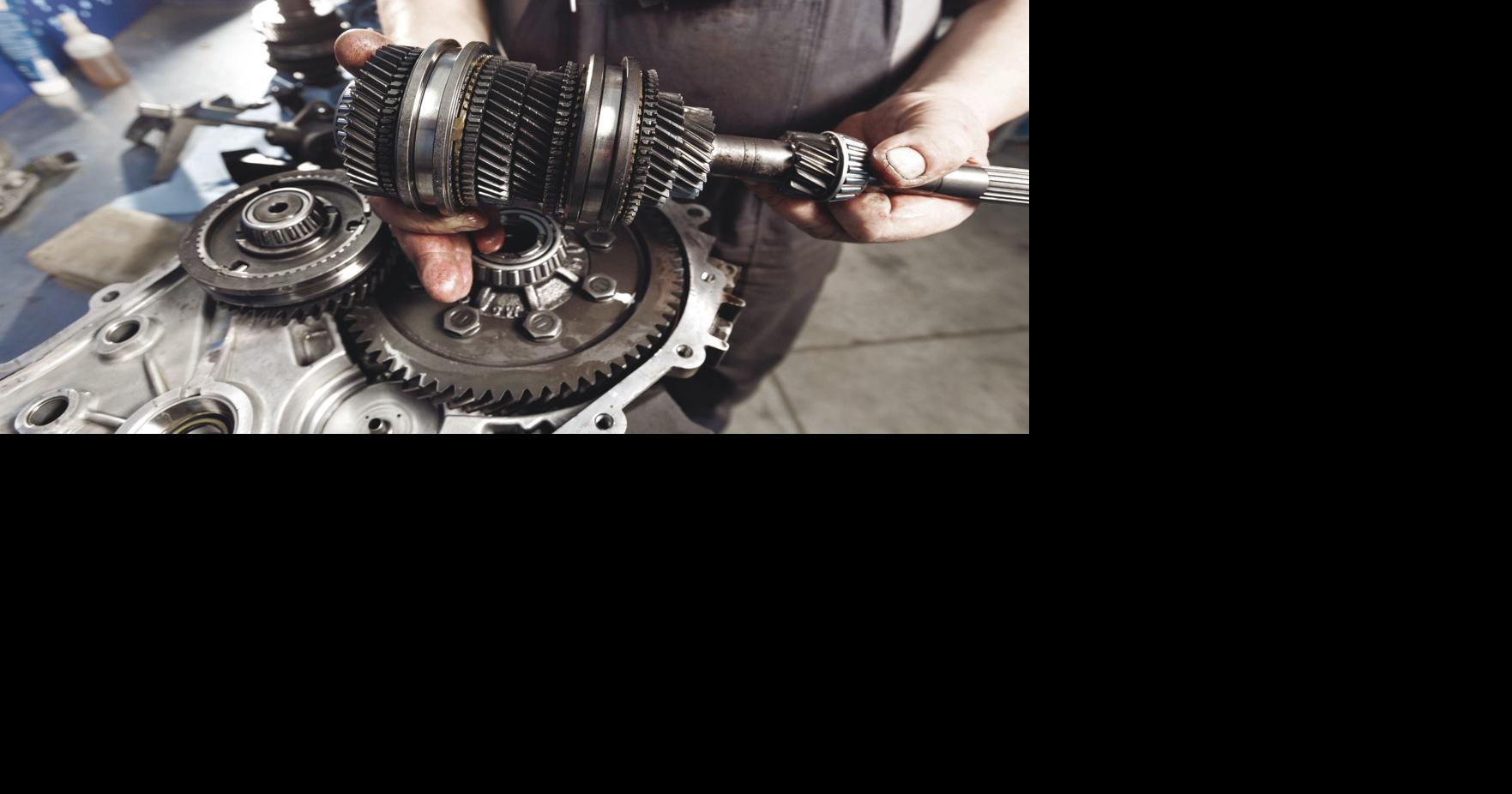 Cross-section of a car gearbox. mechanics work in the garage. hand ...
