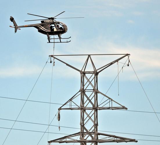 Photos: Helicopter aids in AEP high-wire act | News | wvgazettemail.com