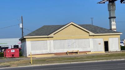Order to demolish former Quik Mart at prominent intersection tabled yet ...