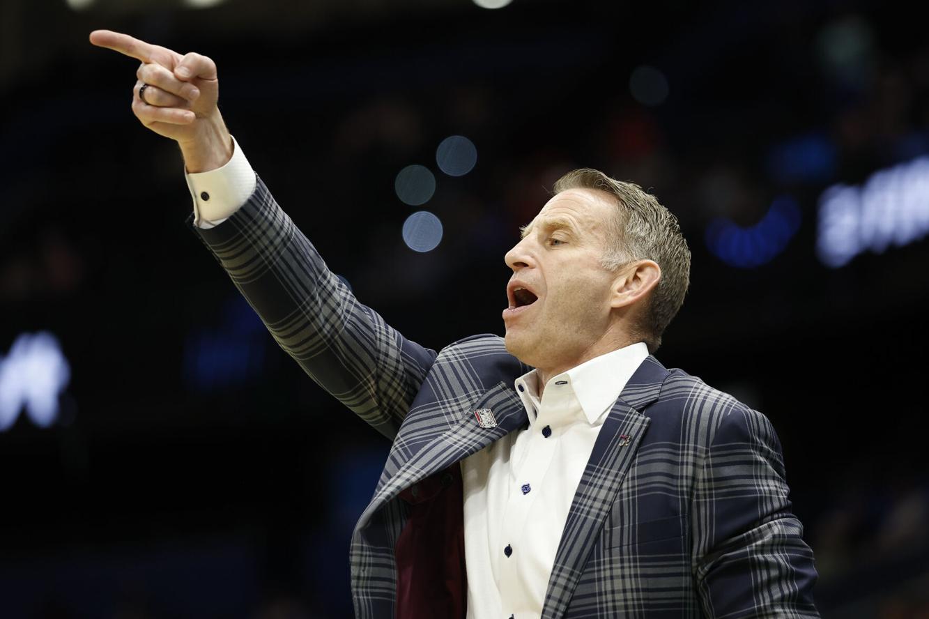 Longtime coaching friends Dusty May of Michigan and Nate Oats of ...