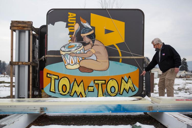 Two historic neon signs are being restored, with a plan to display them ...