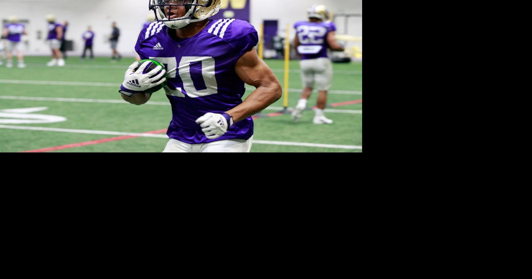 UW running back kept playing while under investigation for alleged ...
