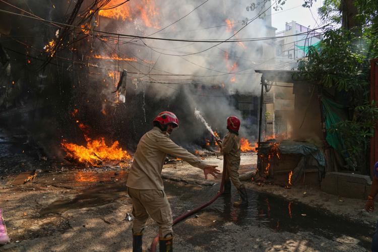 Photos show rescue efforts and aftermath of New Delhi building fire ...