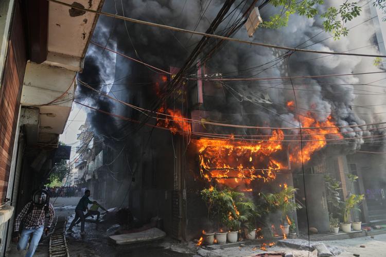 Photos show rescue efforts and aftermath of New Delhi building fire ...