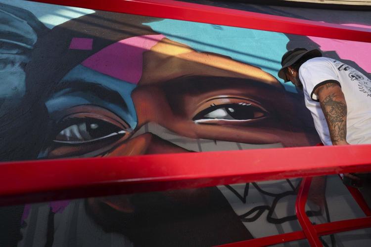 Ten artists paint Seattle murals representing migration and belonging ...