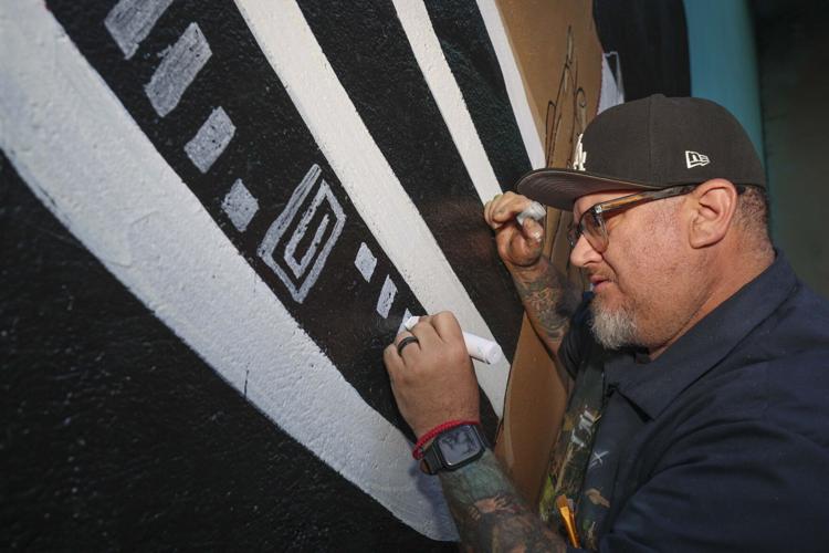 Ten artists paint Seattle murals representing migration and belonging ...
