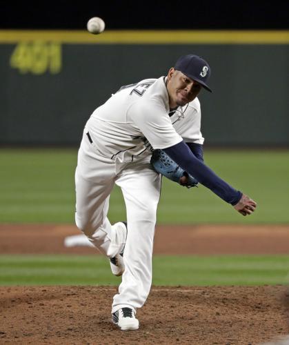 Grand opening: Cruz's home run, Hernandez's pitching lead Mariners past ...