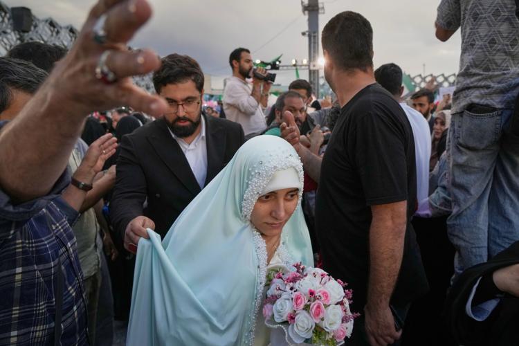 Photos of a mass wedding and a colorful missile at Tehran's 'Sacrifice ...
