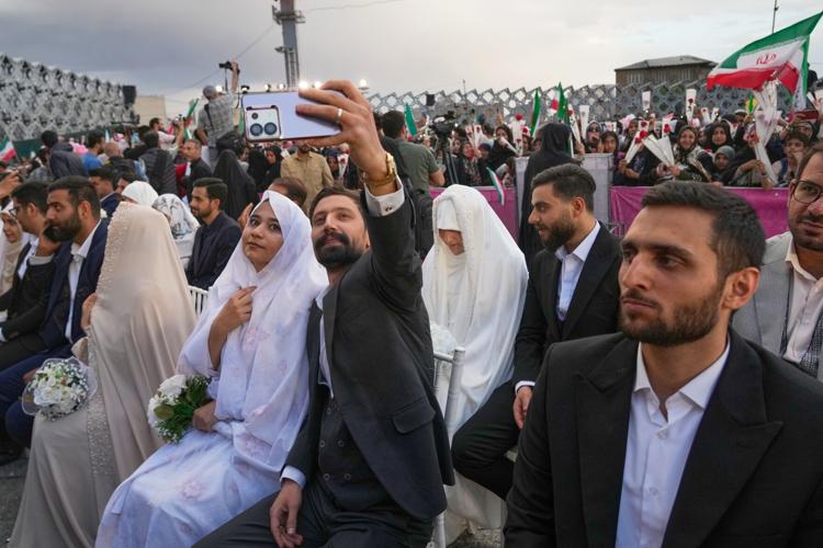 Photos of a mass wedding and a colorful missile at Tehran's 'Sacrifice ...