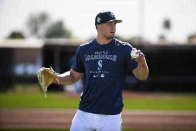 Mariners first baseman Evan White needs surgery to repair a sports ...