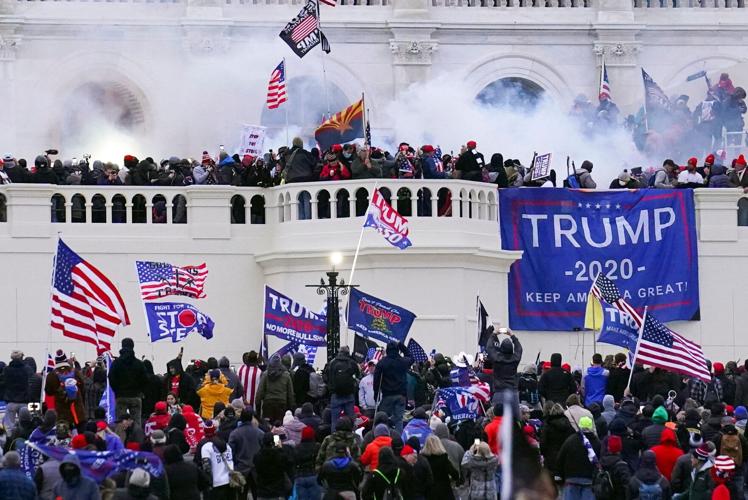Officers who defended Capitol from rioters sue to block payouts from $1 ...