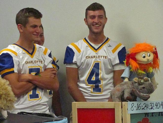 Football players promote reading at Peace River | News Archives ...